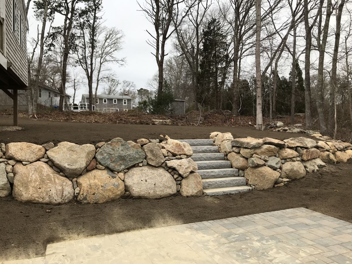 Natural Rock Retaining Wall Installation in Falmouth, MA